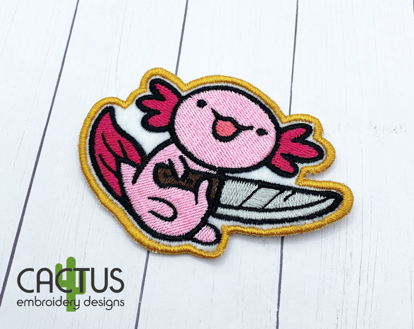 Axolotl with a Knife Patch Embroidery Design – Cactus Embroidery Designs